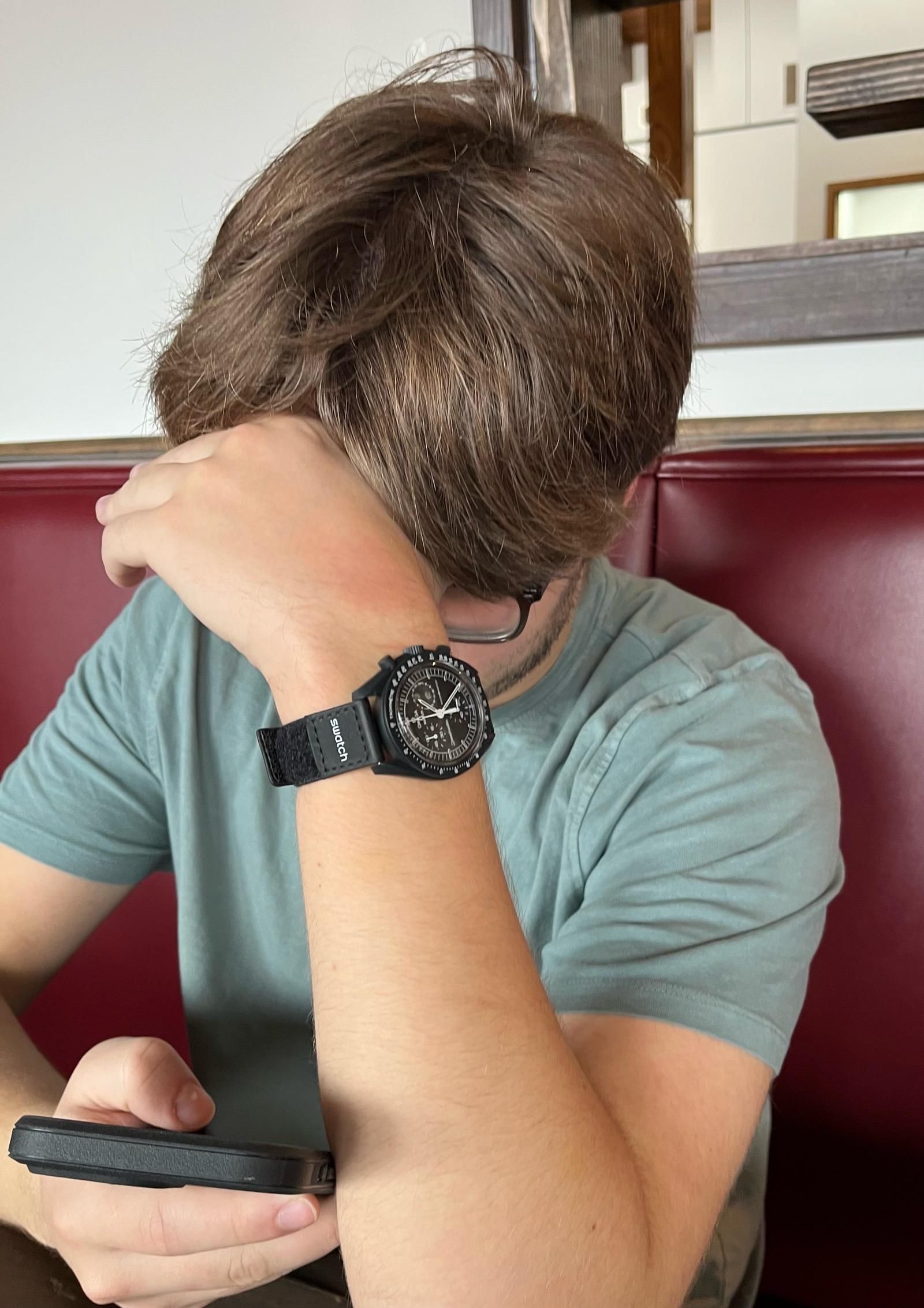 My son with his Mission to the Moonphase Snoopy Moonswatch. | WatchCrunch